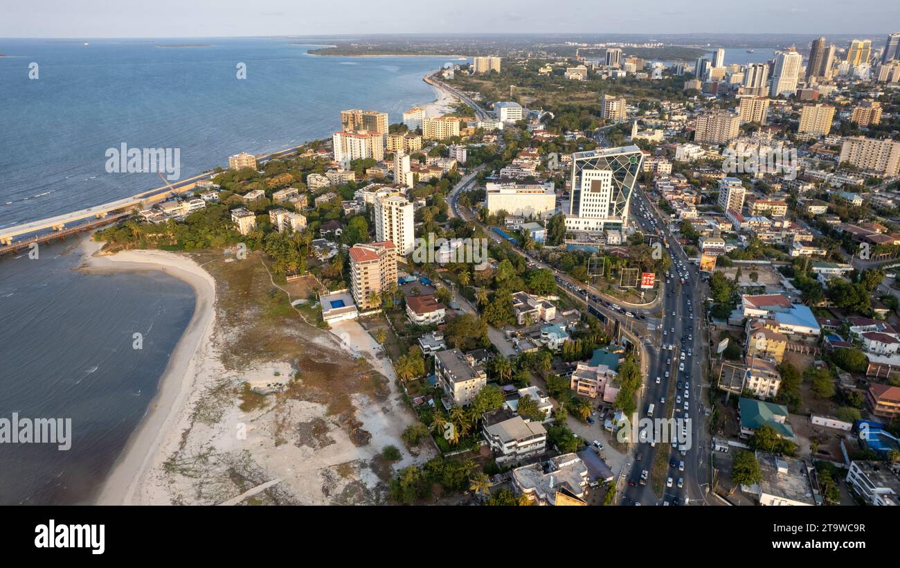 This aerial shot features a stunning vista of an empty beach, with an ...