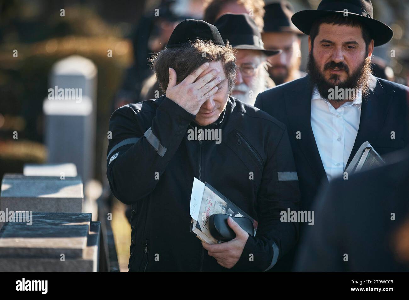 Argentina's President-elect, Javier Milei, center left, leaves after ...