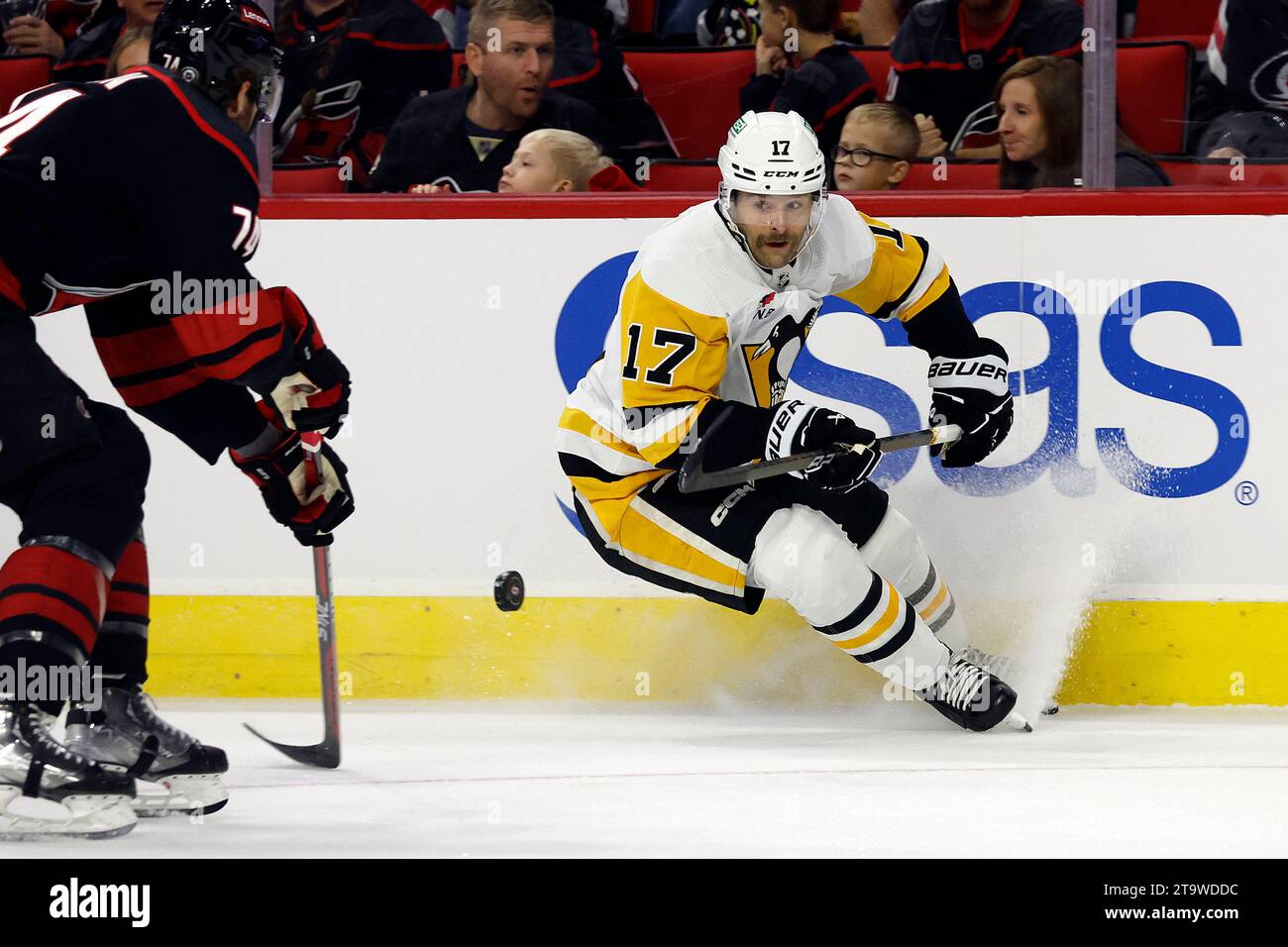 Pittsburgh Penguins' Bryan Rust (17) tries to move the puck past ...