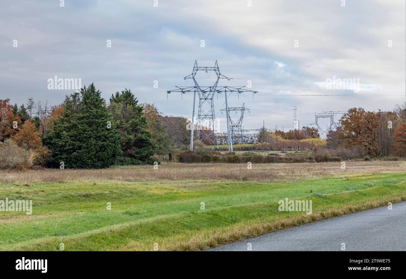 Large electricity pylons leaving a nuclear power plant off into the ...