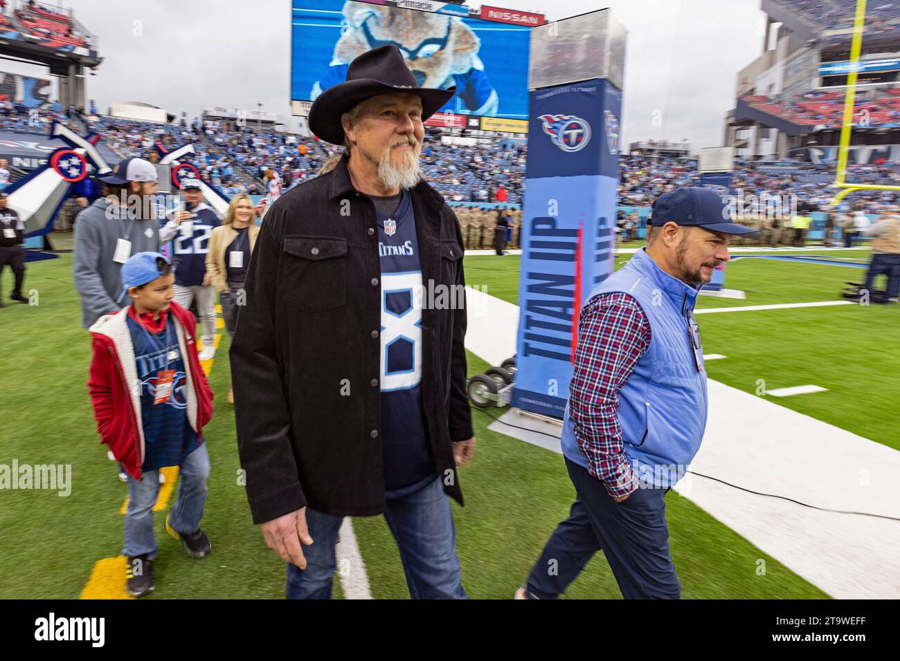 Country music entertainer Trace Adkins walks onto the field to sing the ...