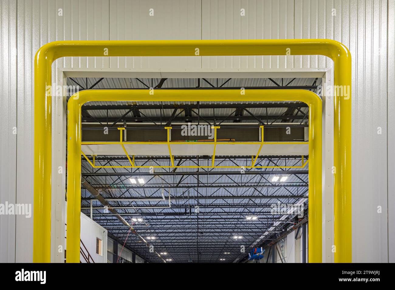 Looking up at yellow door guard piping and the backside of an ...
