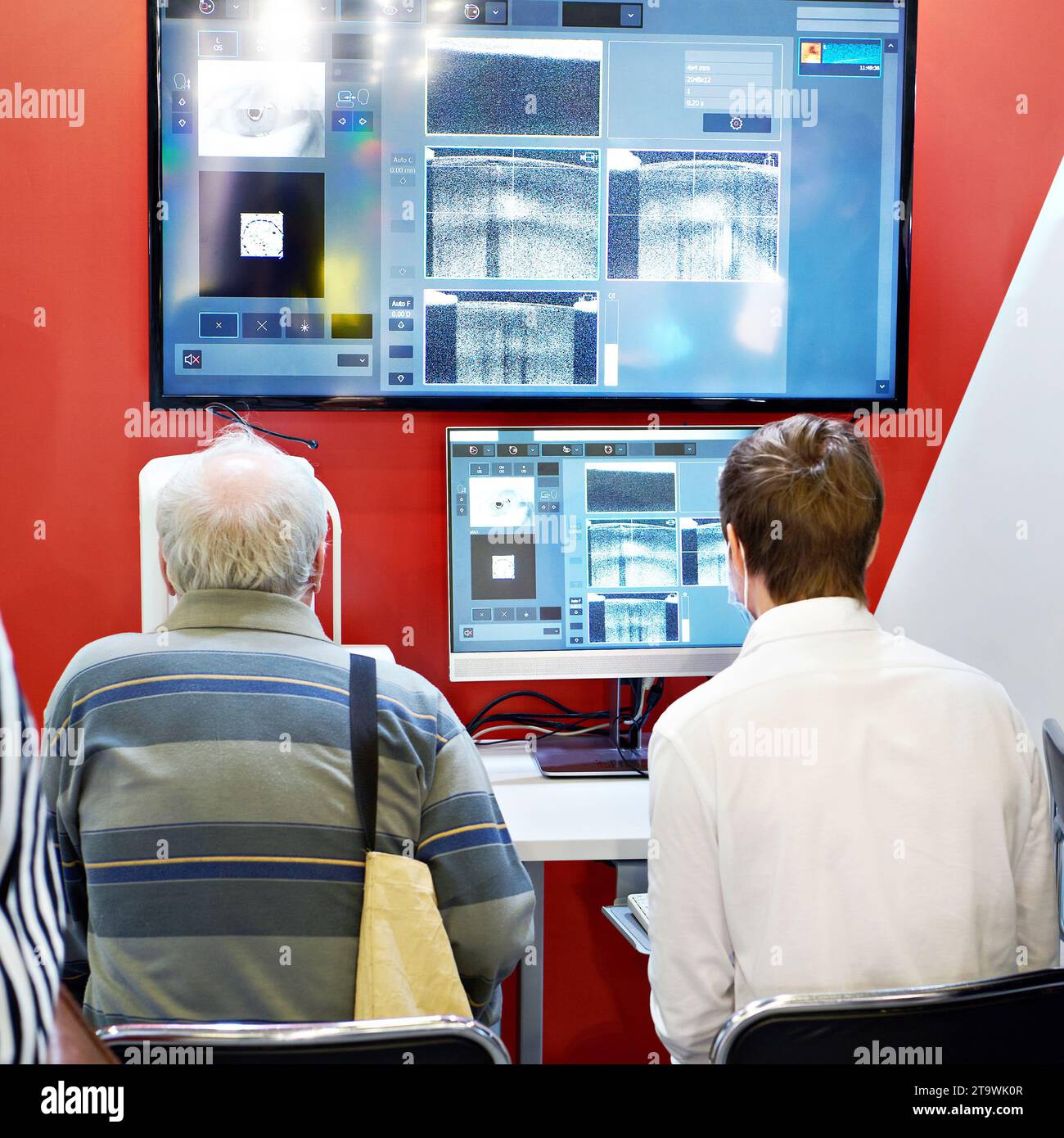 Doctor and patient with ophthalmic spectral optical coherent tomograph ...