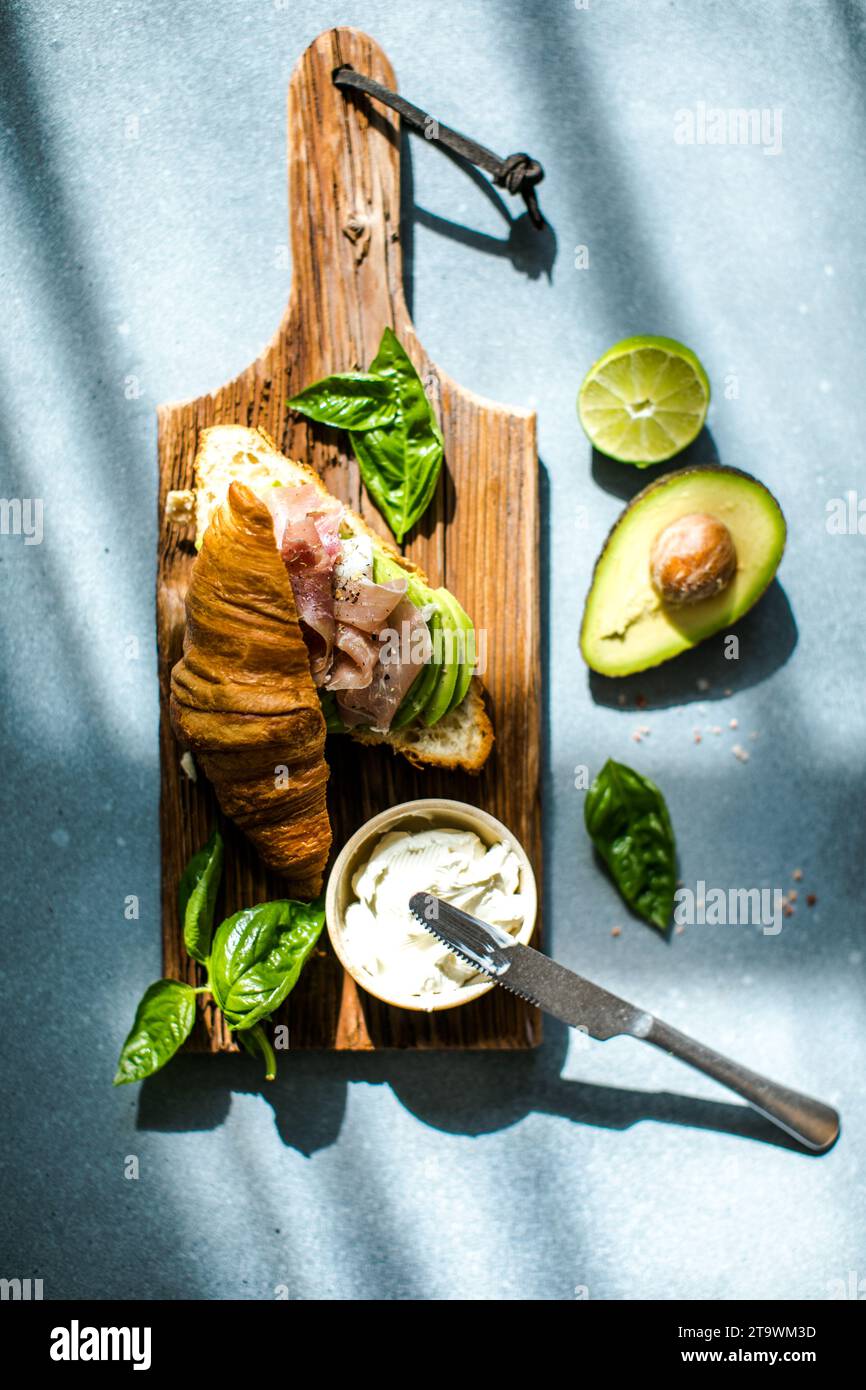 Croissant sandwiches with jamon ham serrano paleta iberica, avocado ...