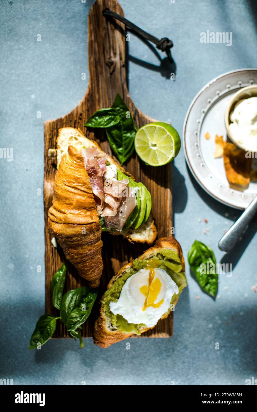 Croissant sandwiches with jamon ham serrano paleta iberica, avocado ...