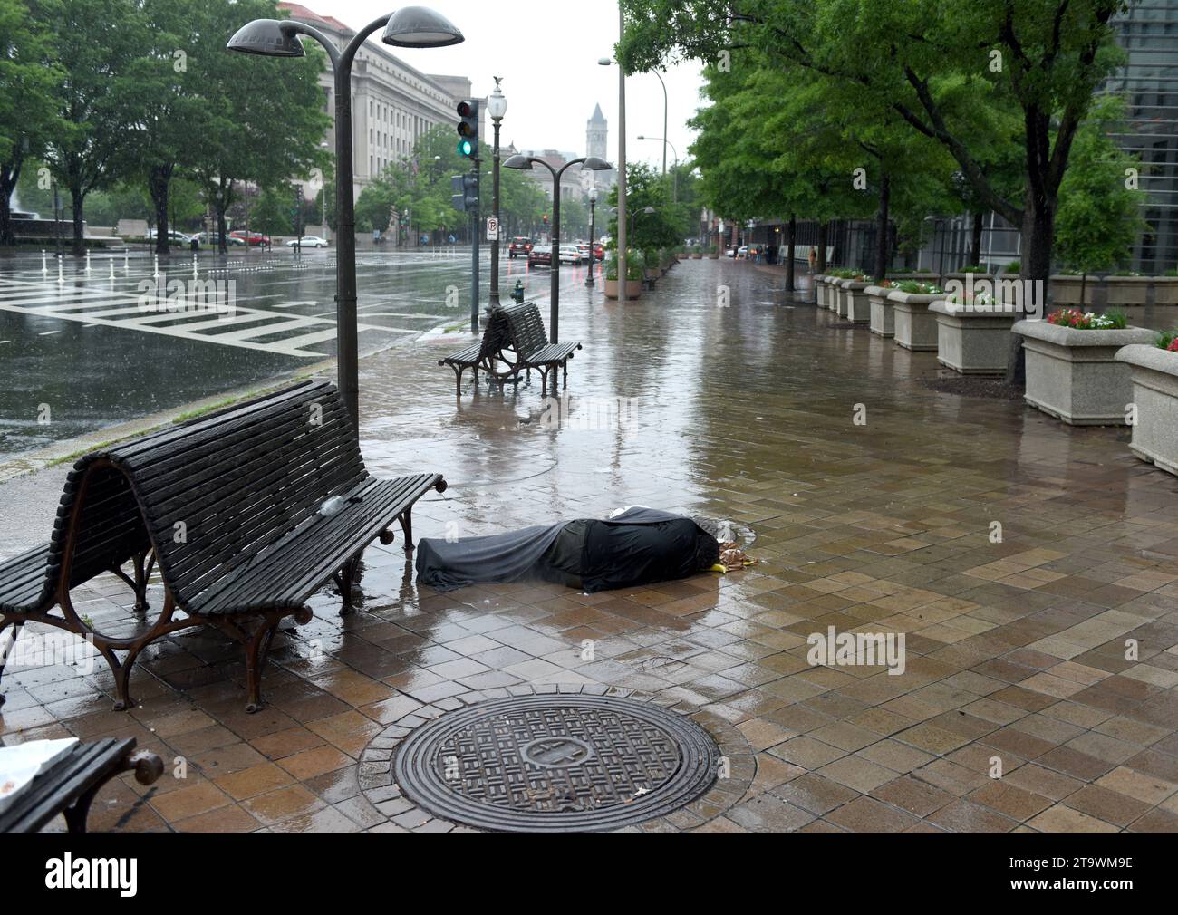 Washington, DC - June 03, 2018: Homeless man lies on the sidewalk on ...