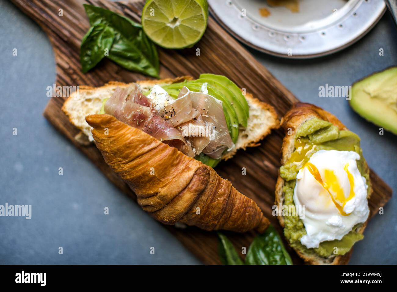 Croissant sandwiches with jamon ham serrano paleta iberica, avocado ...