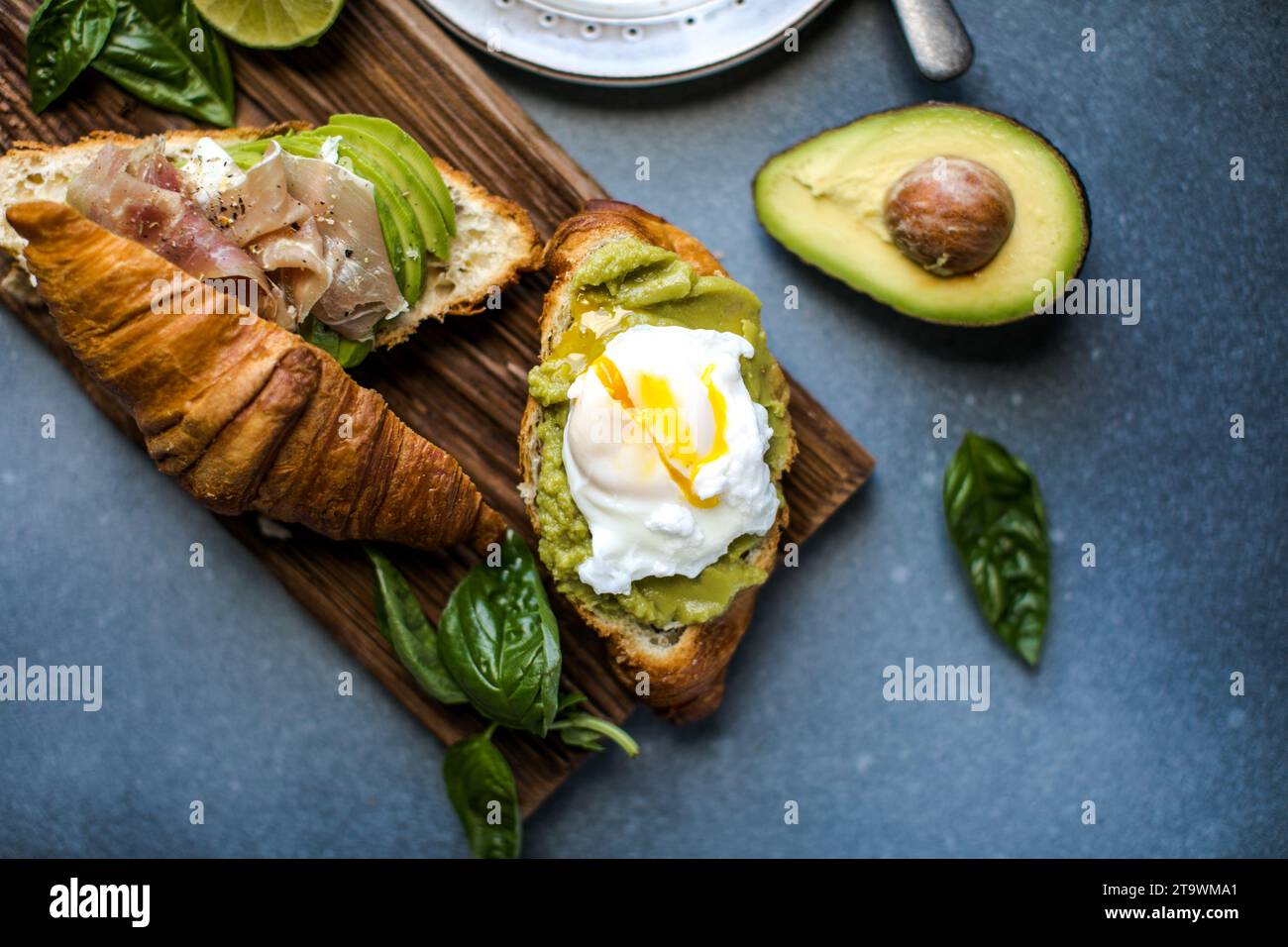 Croissant sandwiches with jamon ham serrano paleta iberica, avocado ...