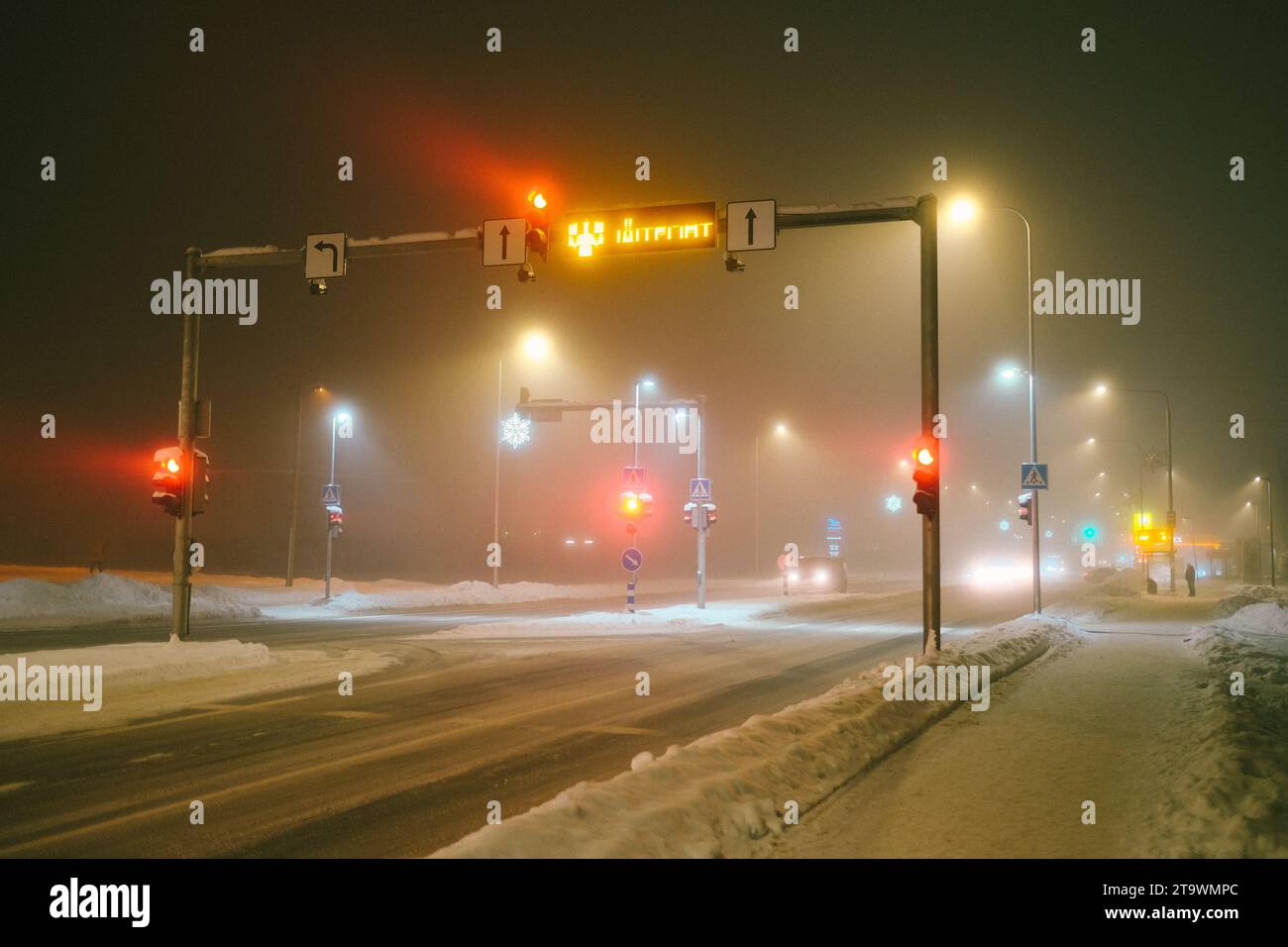 Dark foggy intersection with red lights Stock Photo - Alamy