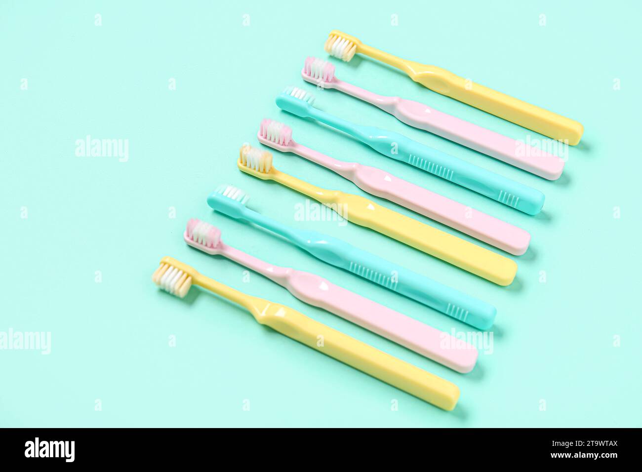 Colorful plastic toothbrushes on color background Stock Photo - Alamy