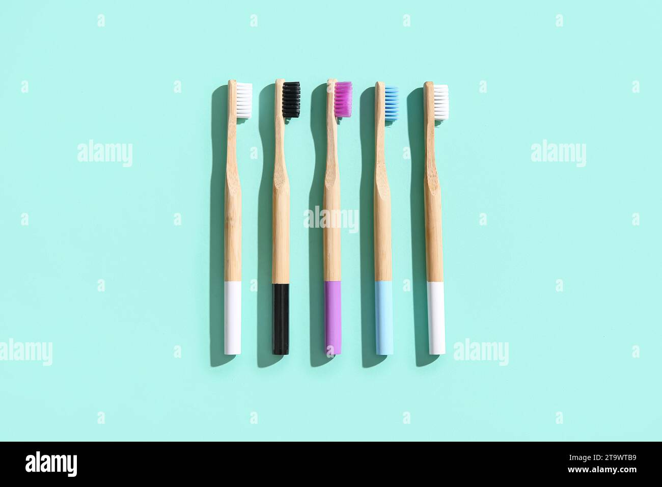 Wooden colorful toothbrushes on color background Stock Photo - Alamy