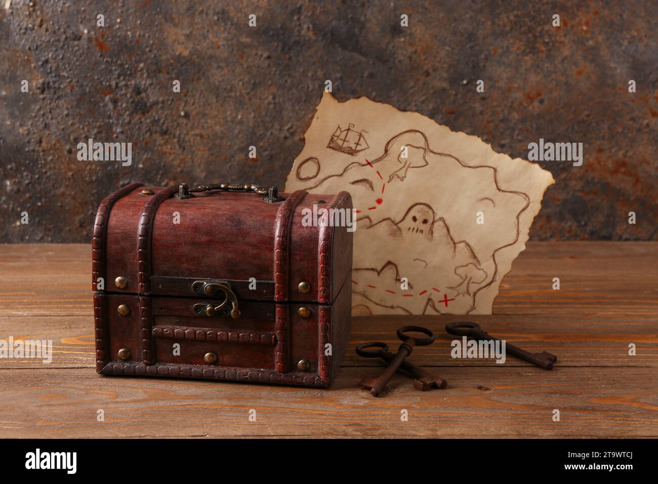 Old chest with keys and treasure map on brown wooden background Stock ...