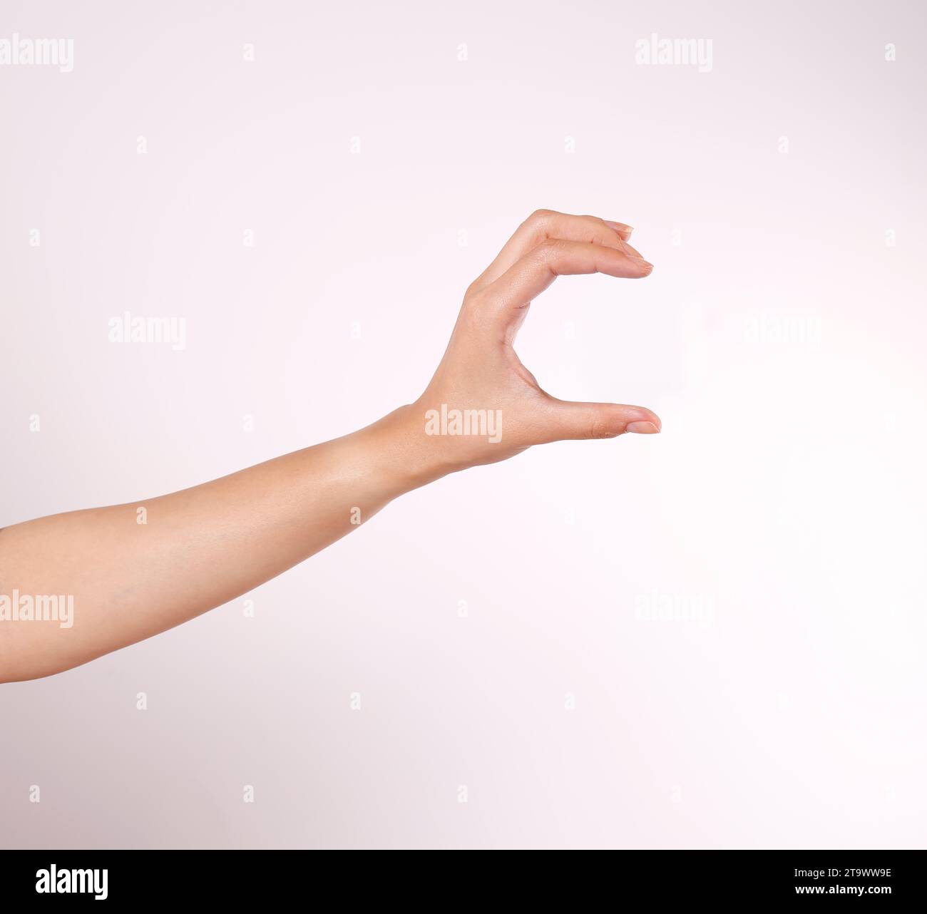 Woman's hand making gesture while grab some items isolated on white ...