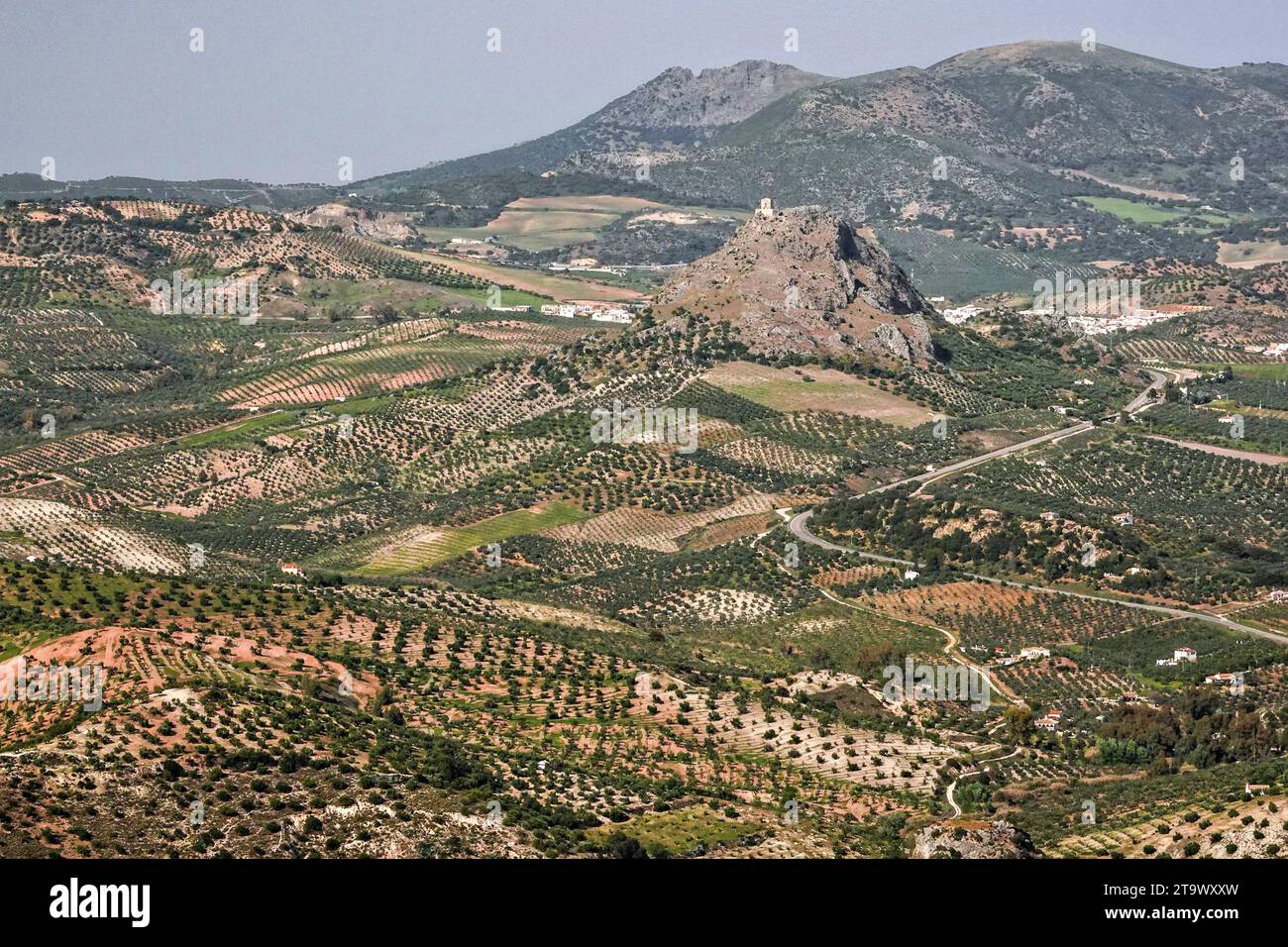 An ancient Moorish watch tower sits on a far hilltop surrounded by ...