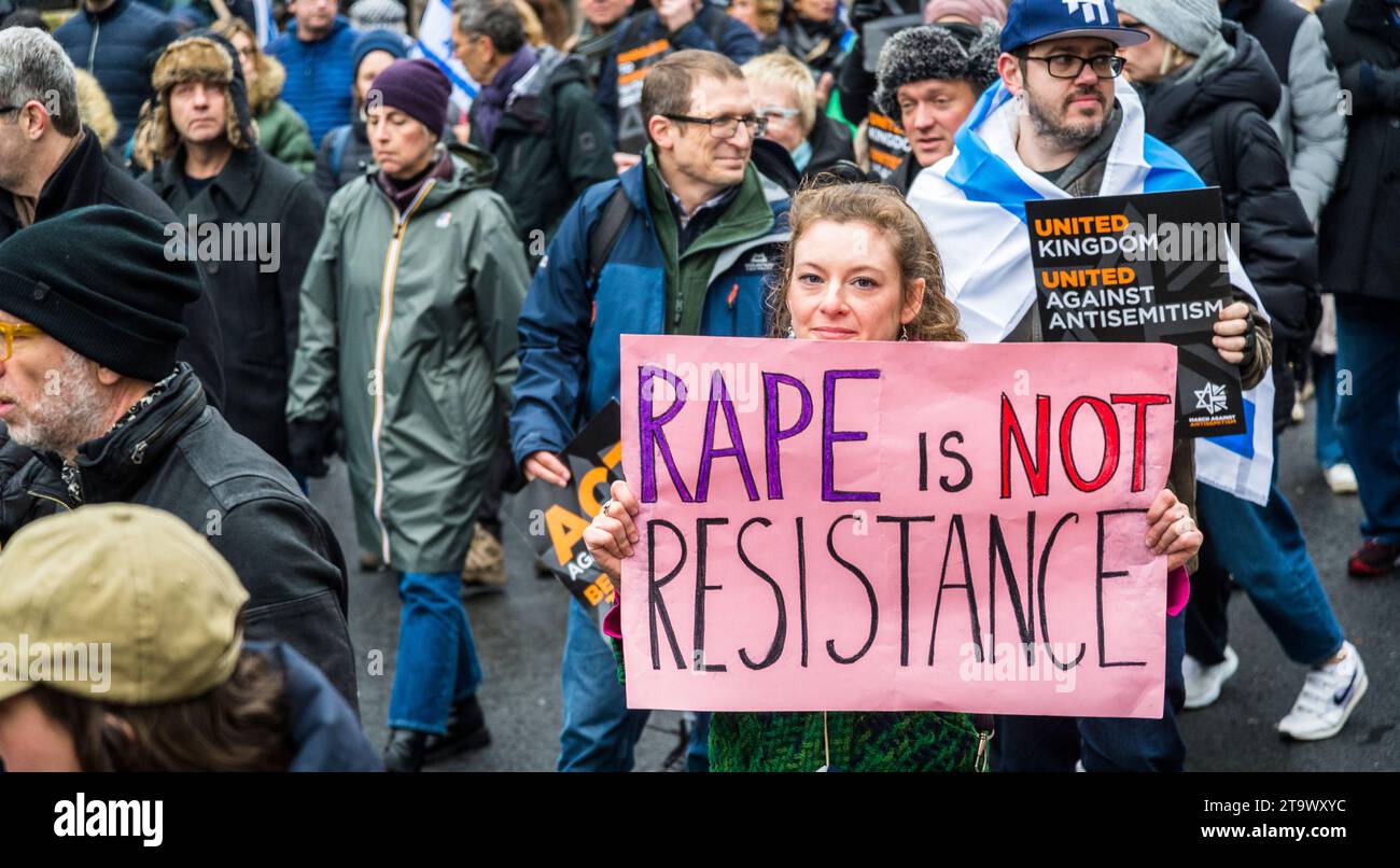 Woman with Rape is not Resistance placard, March against antisemitism, tens of thousands people ...