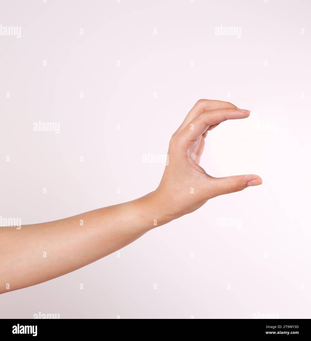 Woman's hand making gesture while grab some items isolated on white ...