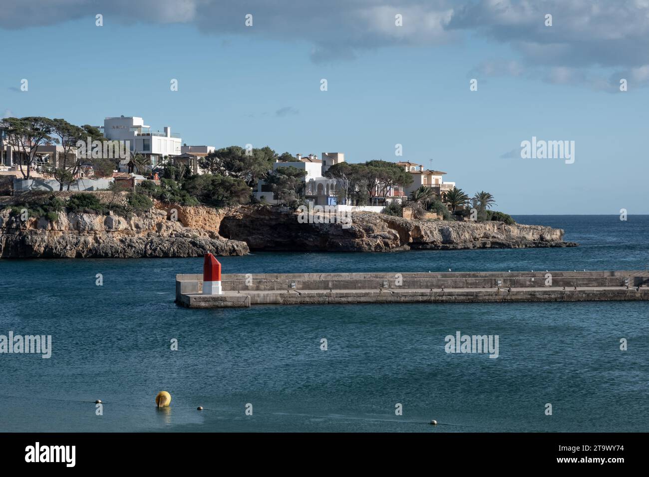 The port of Porto Cristo with beautiful houses nestled on top of the ...