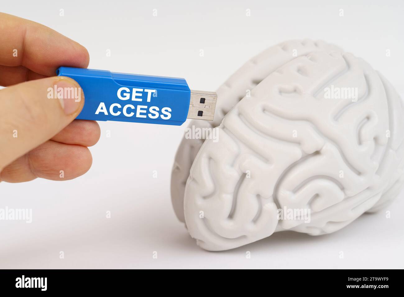 A man inserts a flash drive into his brain with the inscription - Get ...