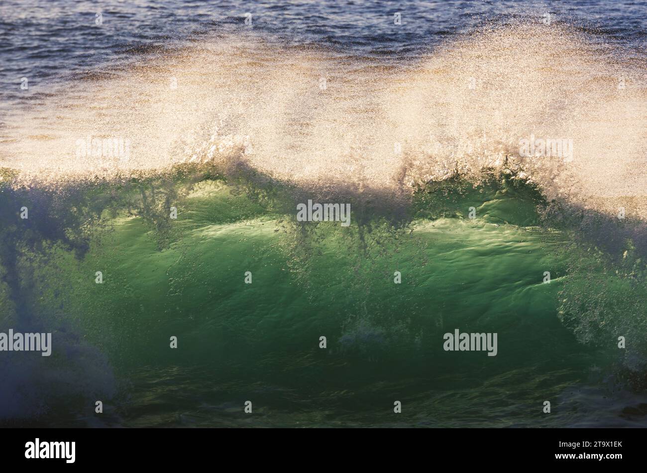 Blue wave on the beach. Dramatic natural background Stock Photo - Alamy