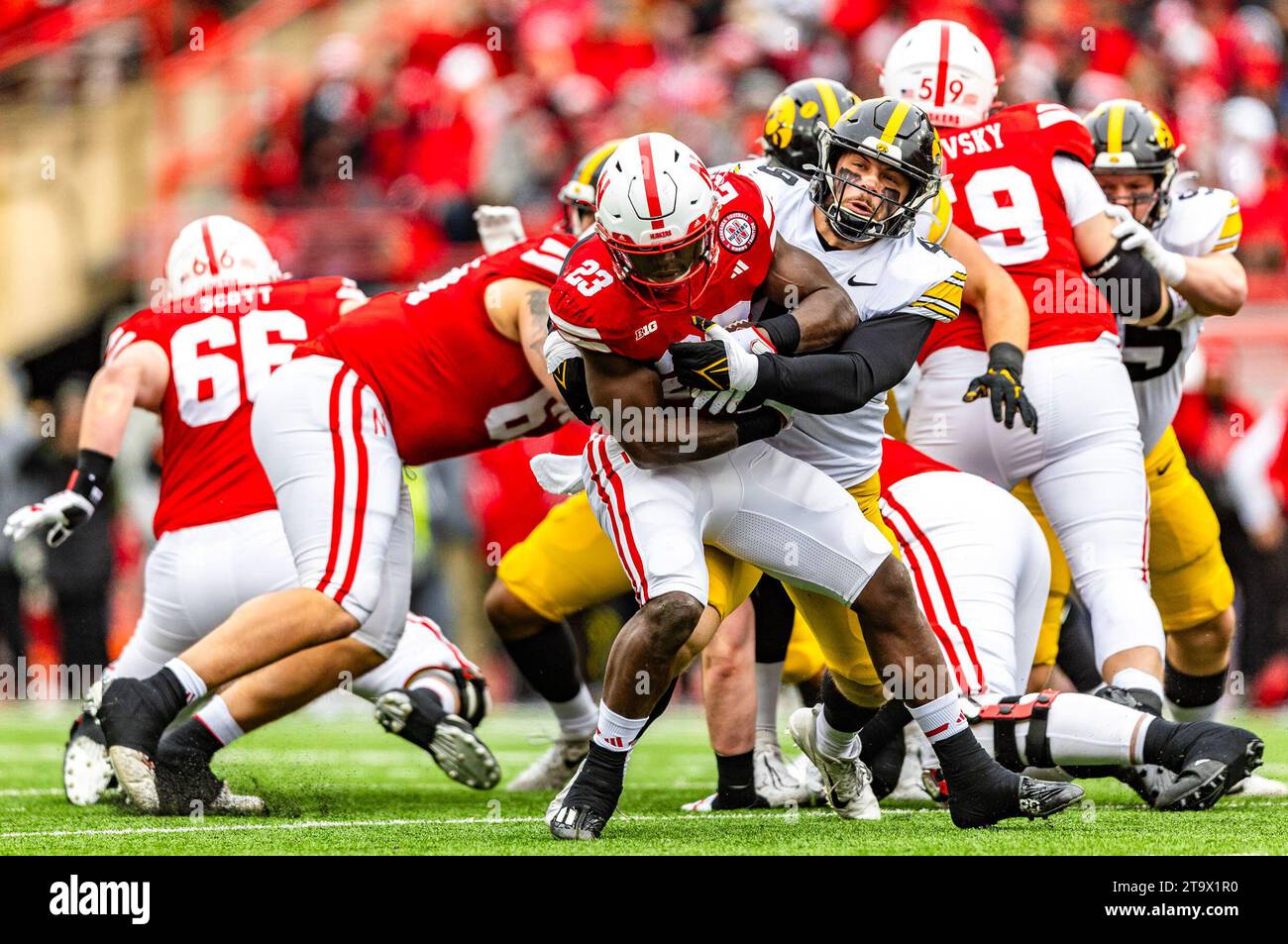 Lincoln, NE. U.S. 24th Nov, 2023. Iowa Hawkeyes defensive lineman Ethan Hurkett (49) tackles ...