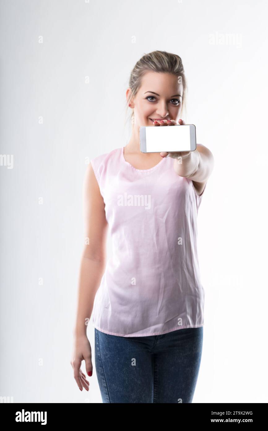 Cheerful presenter with mobile phone portrays potential of technology ...