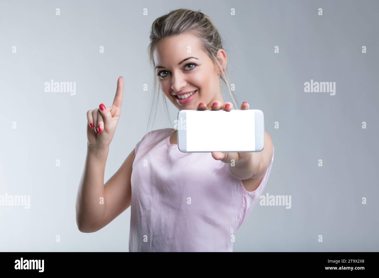 Tech-friendly model with mobile phone gestures towards technological ...