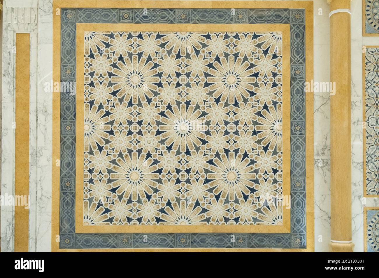 Abu Dhabi, UAE, 08.02.20. Arabic style, granite and marble wall panel mosaic with star and ...