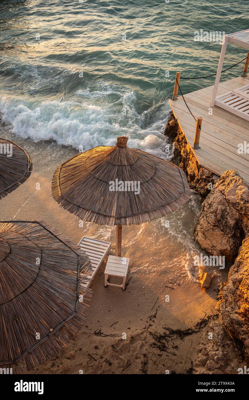 Vertical Landscape of Sandy Beach with Straw Umbrella and Ionian Sea ...