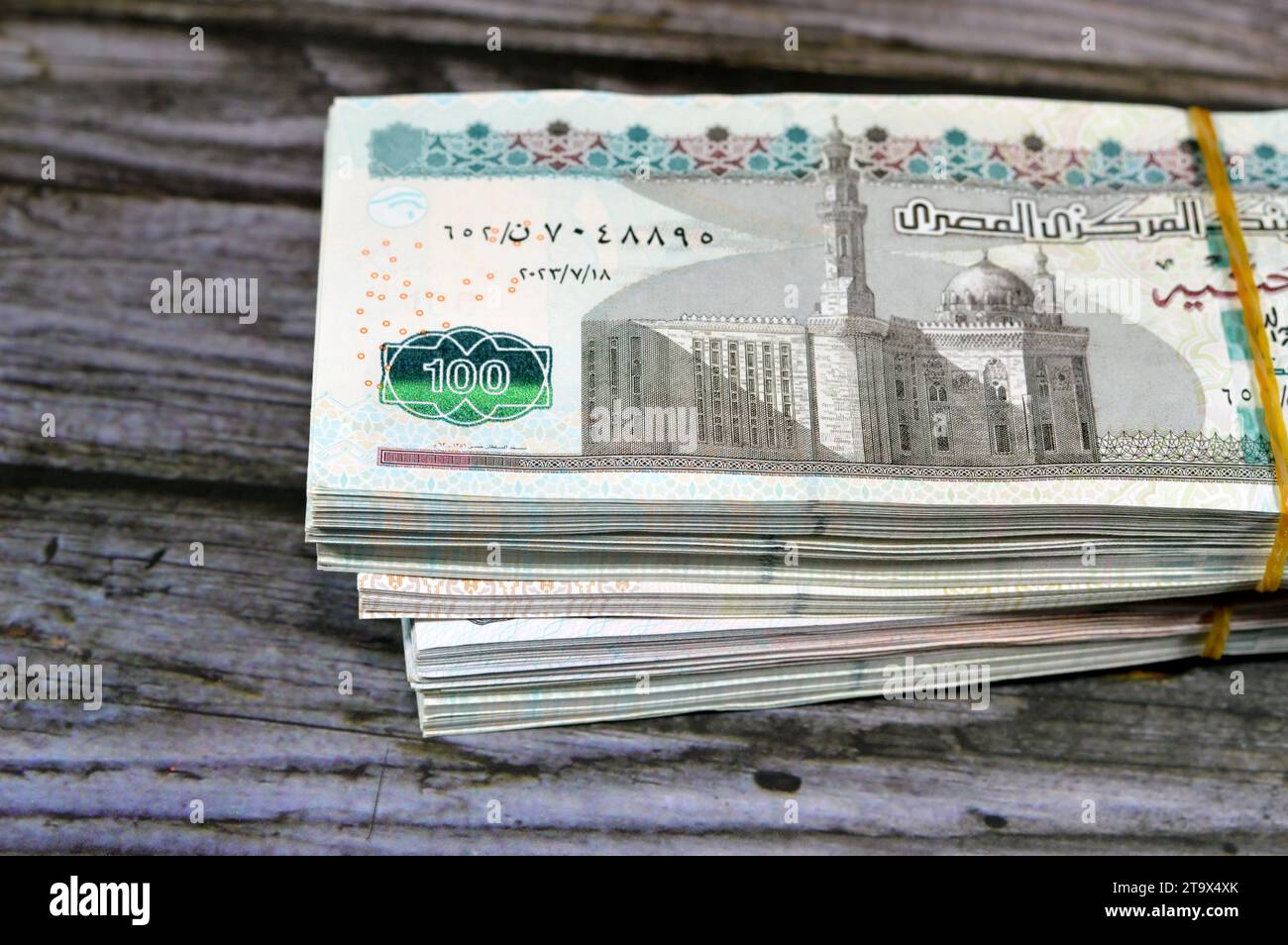 Stacks of Egypt money banknote bills of 200 EGP LE, 100 and 50 EGP LE ...