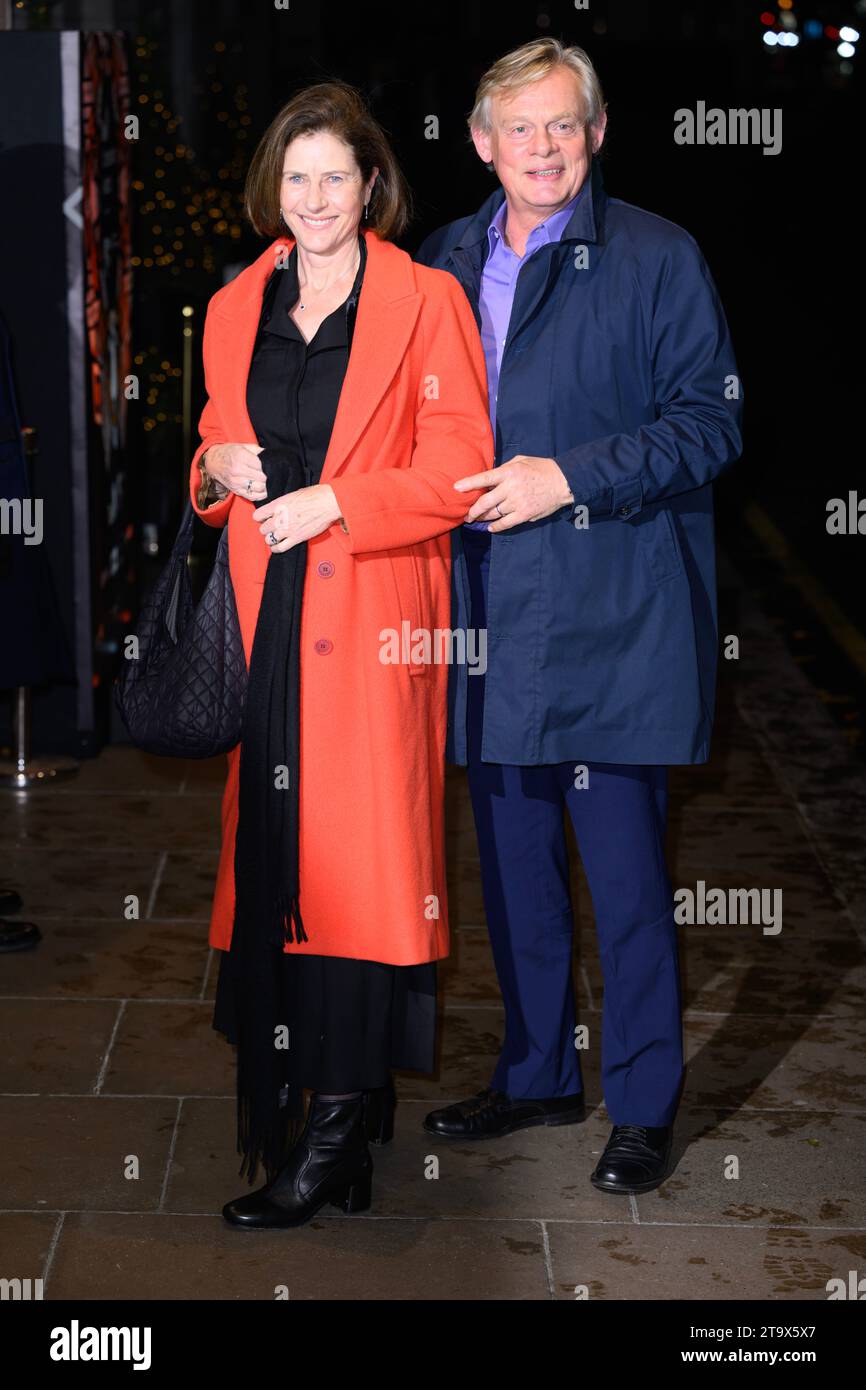 London, UK. November 27th, 2023. Philippa Braithwaite and Martin Clunes ...