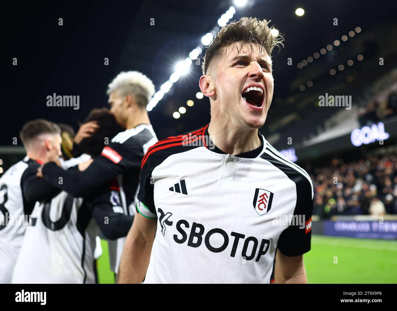 London, UK. 27th Nov, 2023. Tom Cairney of Fulham celebrates their ...