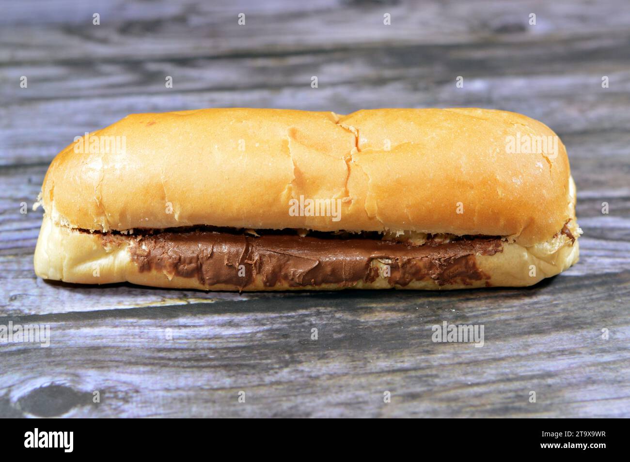 Long bun bread, a fresh baked loaf of bread French Fino, stuffed and ...
