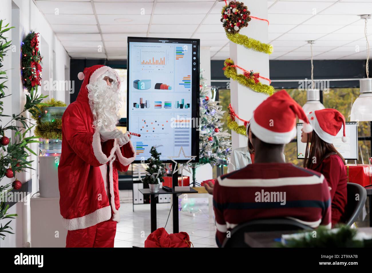 Certified lecturer dressed as Santa Claus teaching employees important ...