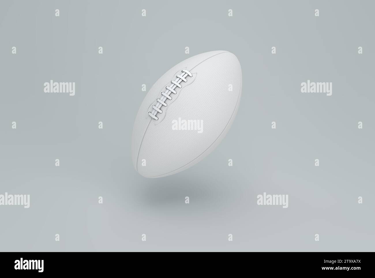 White American Football Ball on a Gray Studio Background. Minimal ...