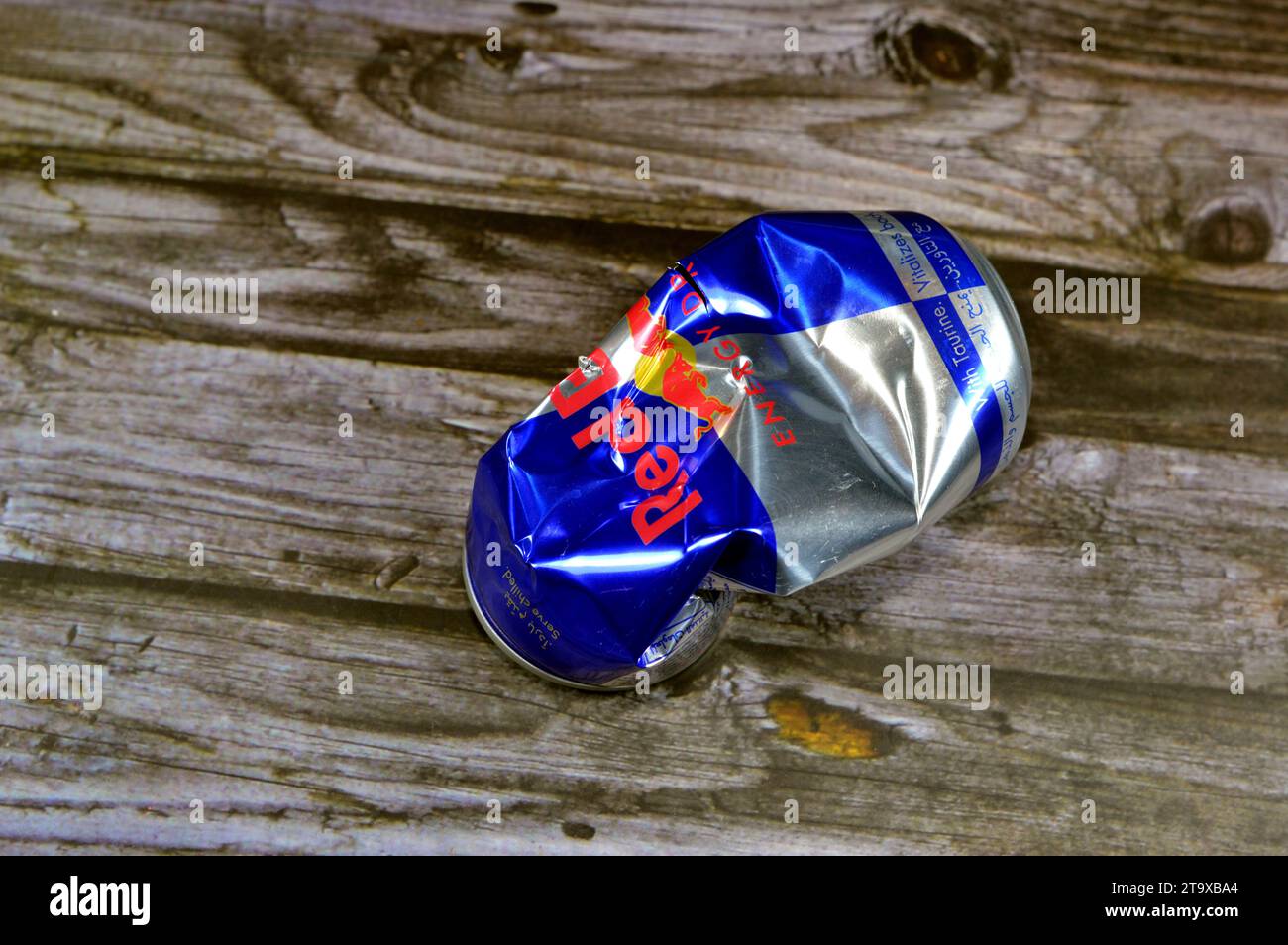 Cairo, Egypt, October 1 2023: Crushed dented Red Bull energy drink, a ...