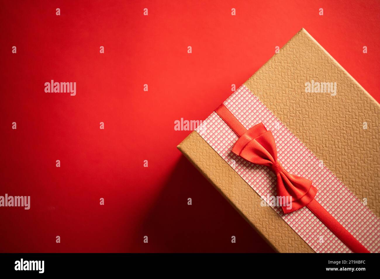 red ribbon on gift box Stock Photo - Alamy