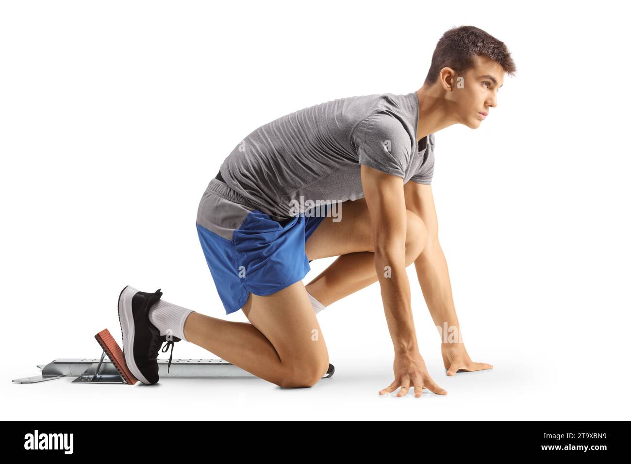 Teenage runner kneeling starting block Cut Out Stock Images & Pictures ...