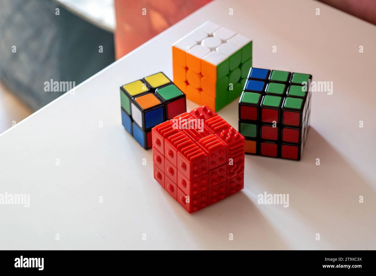 A variety different rubiks cubes on table hi-res stock photography and ...