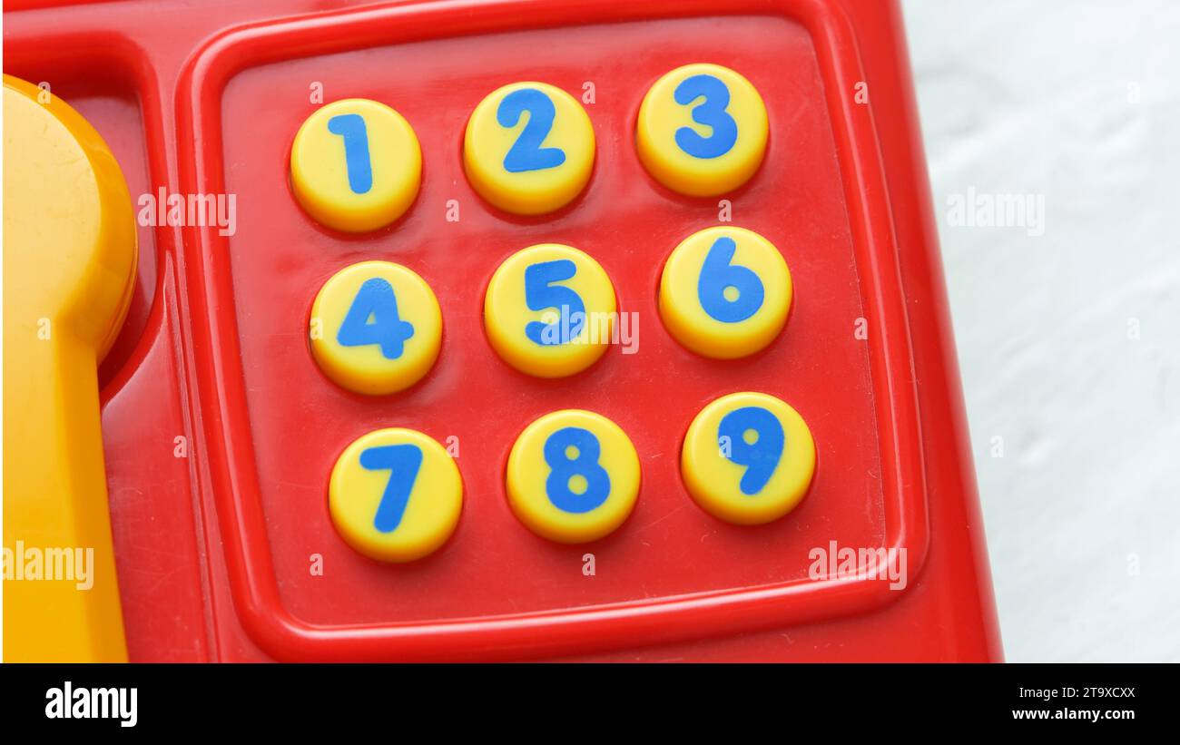 Simple colorful small telephone landline phone toy with little number ...