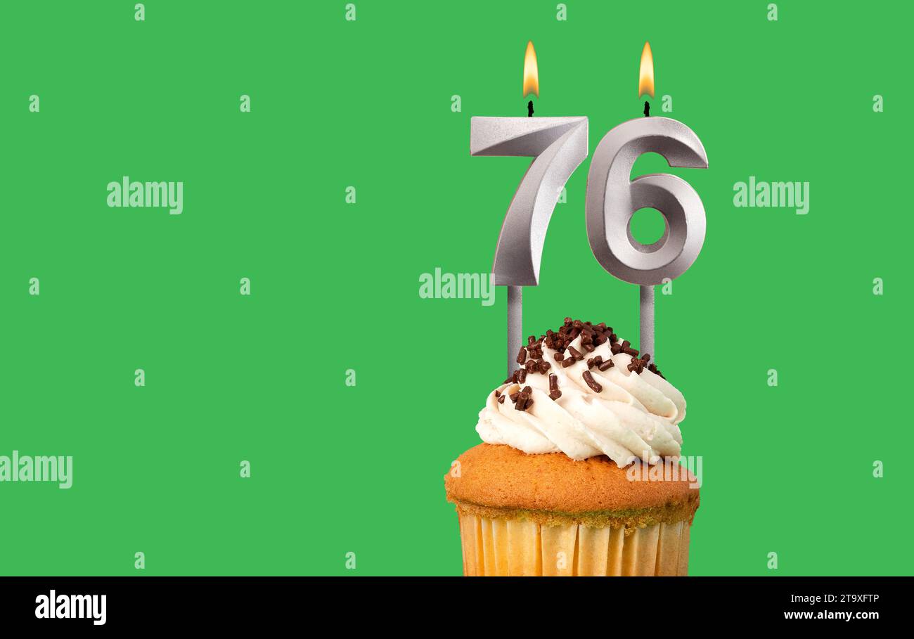 Birthday with number 76 candle and cupcake - Anniversary card on green ...