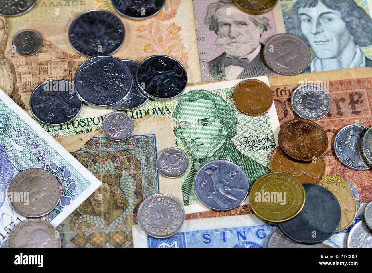 Old money currency of banknotes and coins from different countries of ...