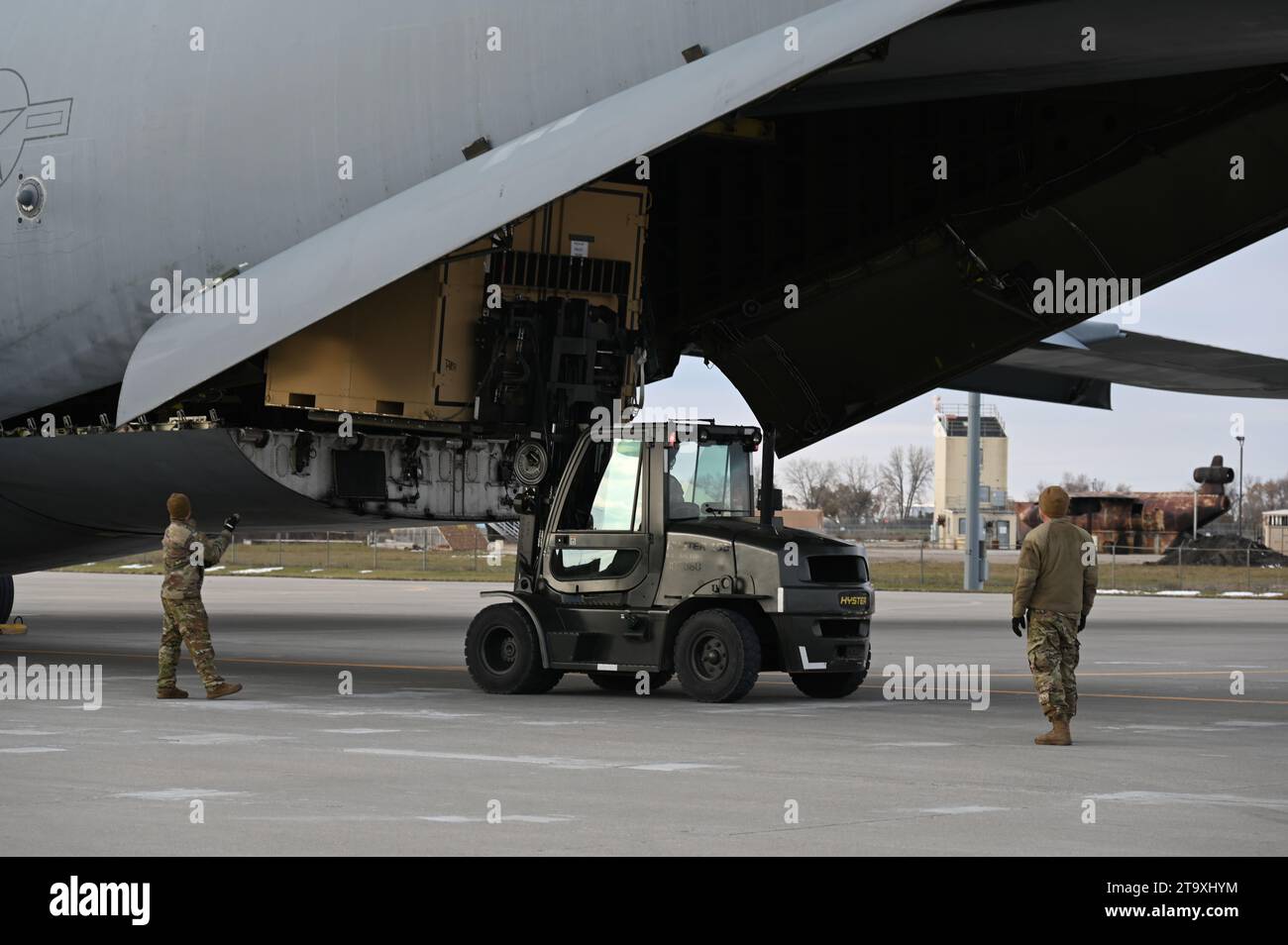 U.S. Air Force Airmen of the 119th Wing maneuvered a forklift to load a ...