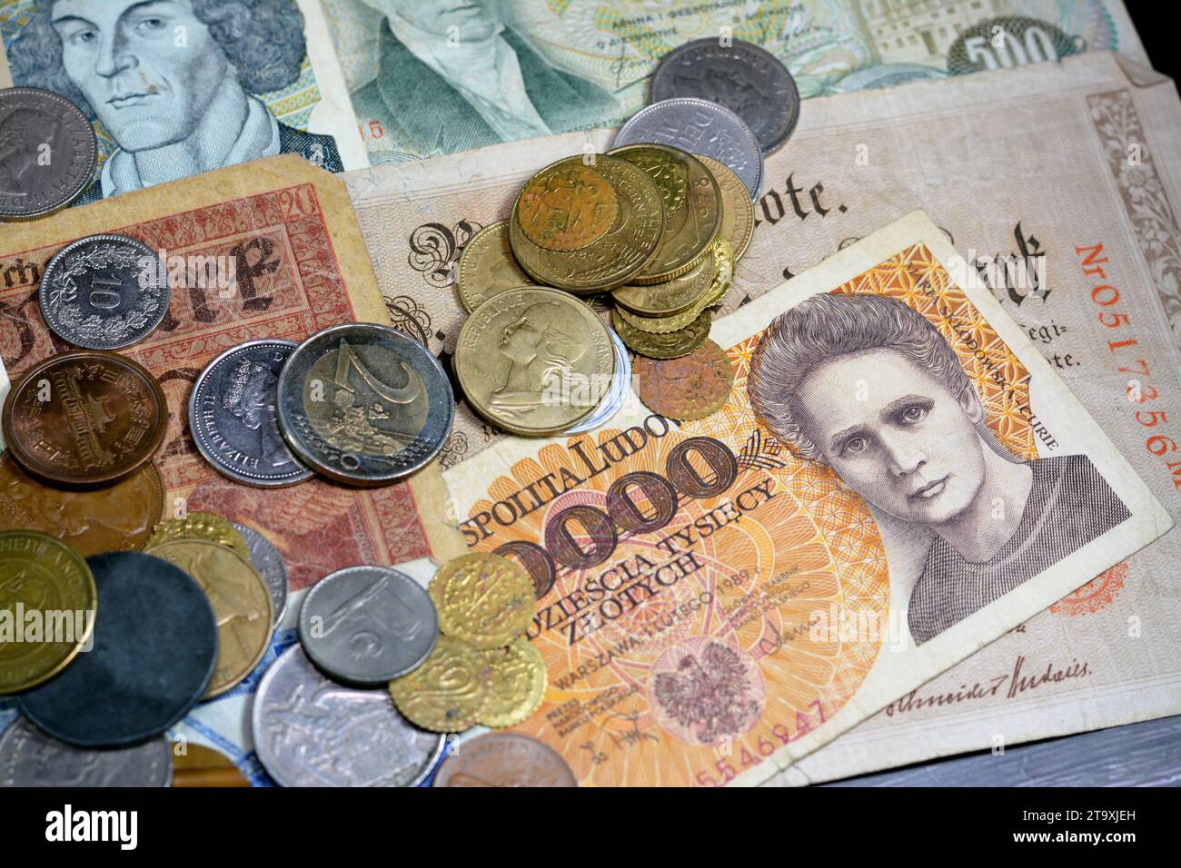 Old money currency of banknotes and coins from different countries of ...