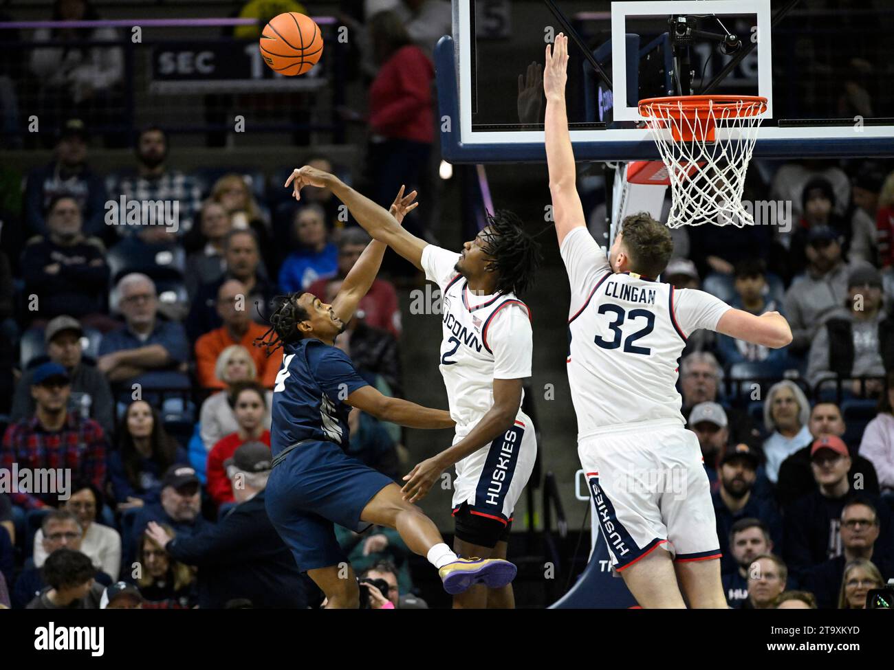 UConn guard Tristen Newton (2) blocks a shot by New Hampshire guard ...