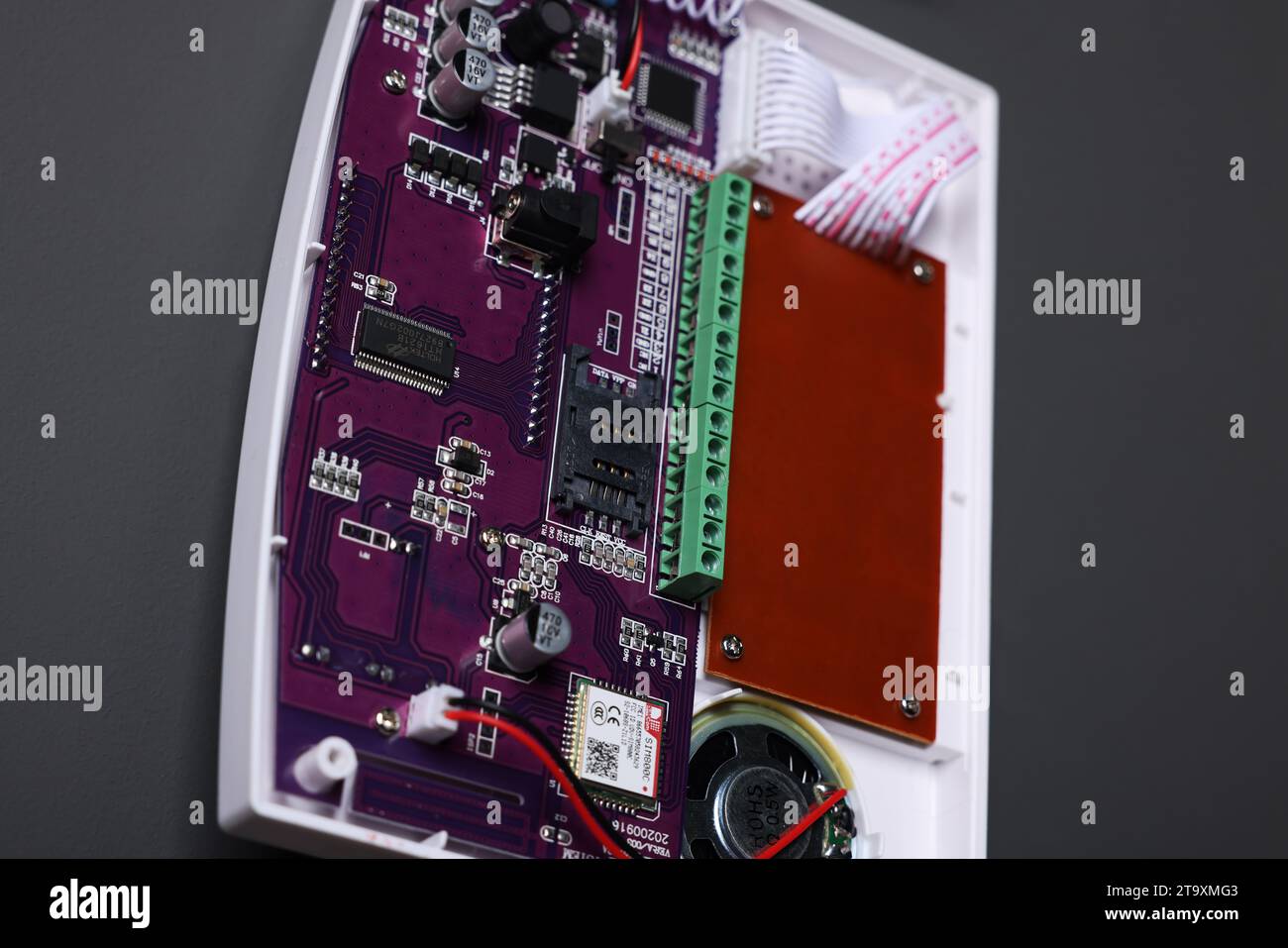 Installation of alarm system. Circuit board on gray wall, closeup Stock ...