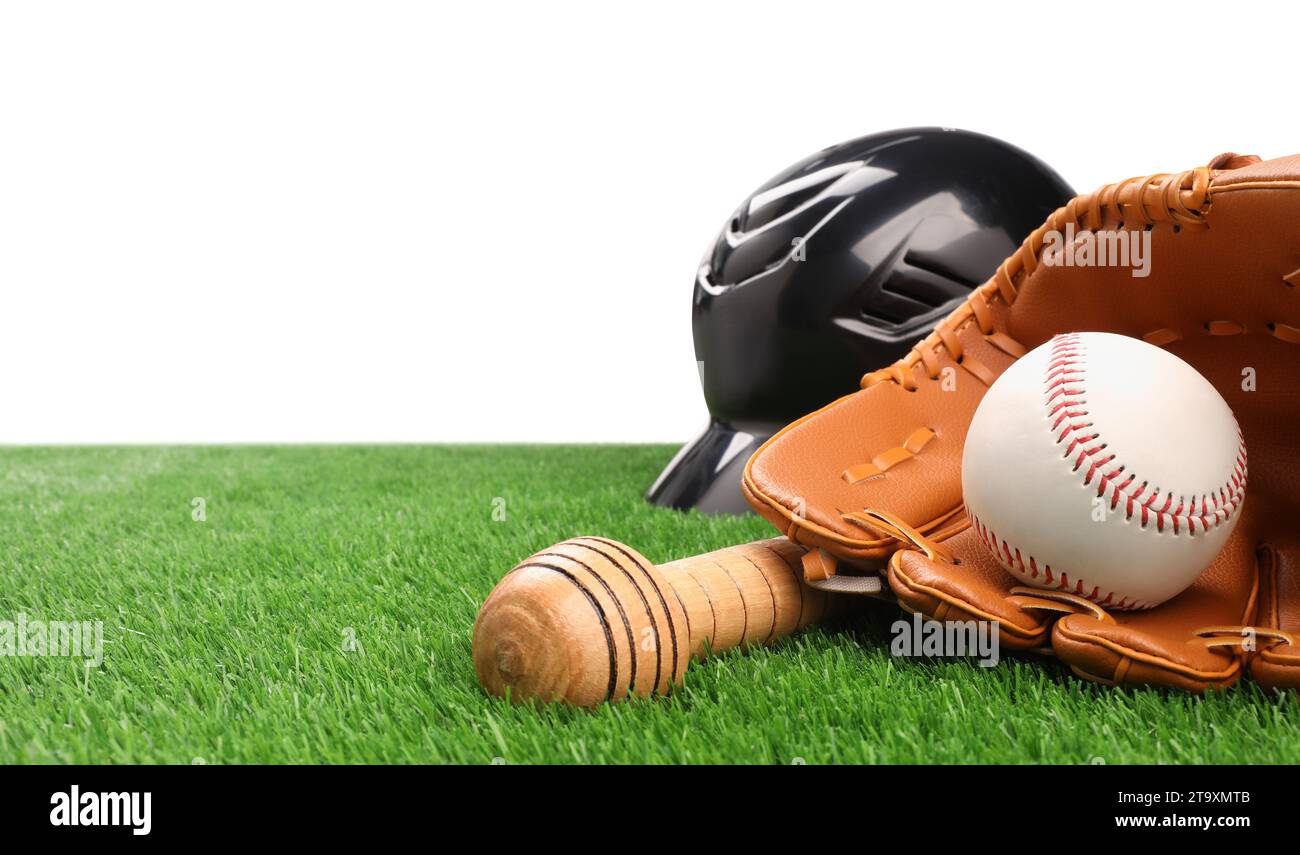 Baseball bat, ball, batting helmet and glove on artificial grass ...