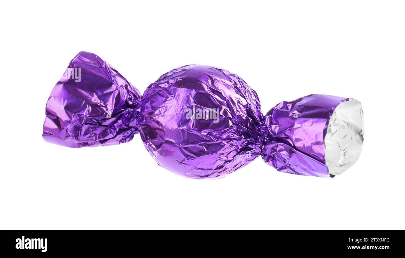 Tasty candy in purple wrapper isolated on white Stock Photo - Alamy