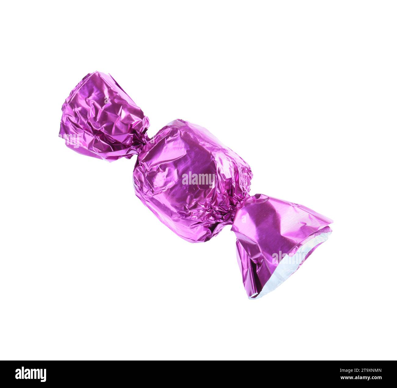 Tasty candy in violet wrapper isolated on white Stock Photo - Alamy