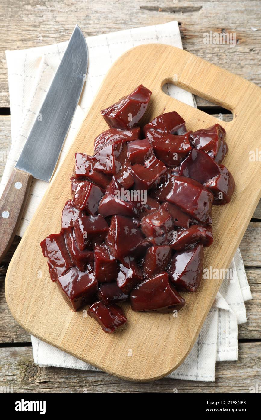 Cut raw beef liver on wooden table, top view Stock Photo - Alamy
