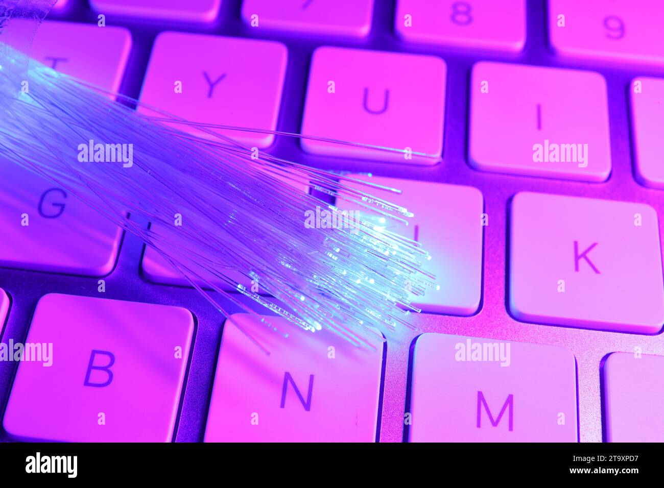 Optical fiber strands transmitting color light on computer keyboard ...